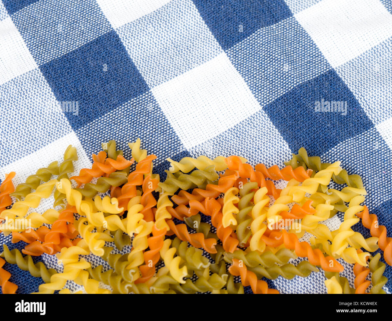 Background of colorful pasta texture close-up. close up of a dried ...