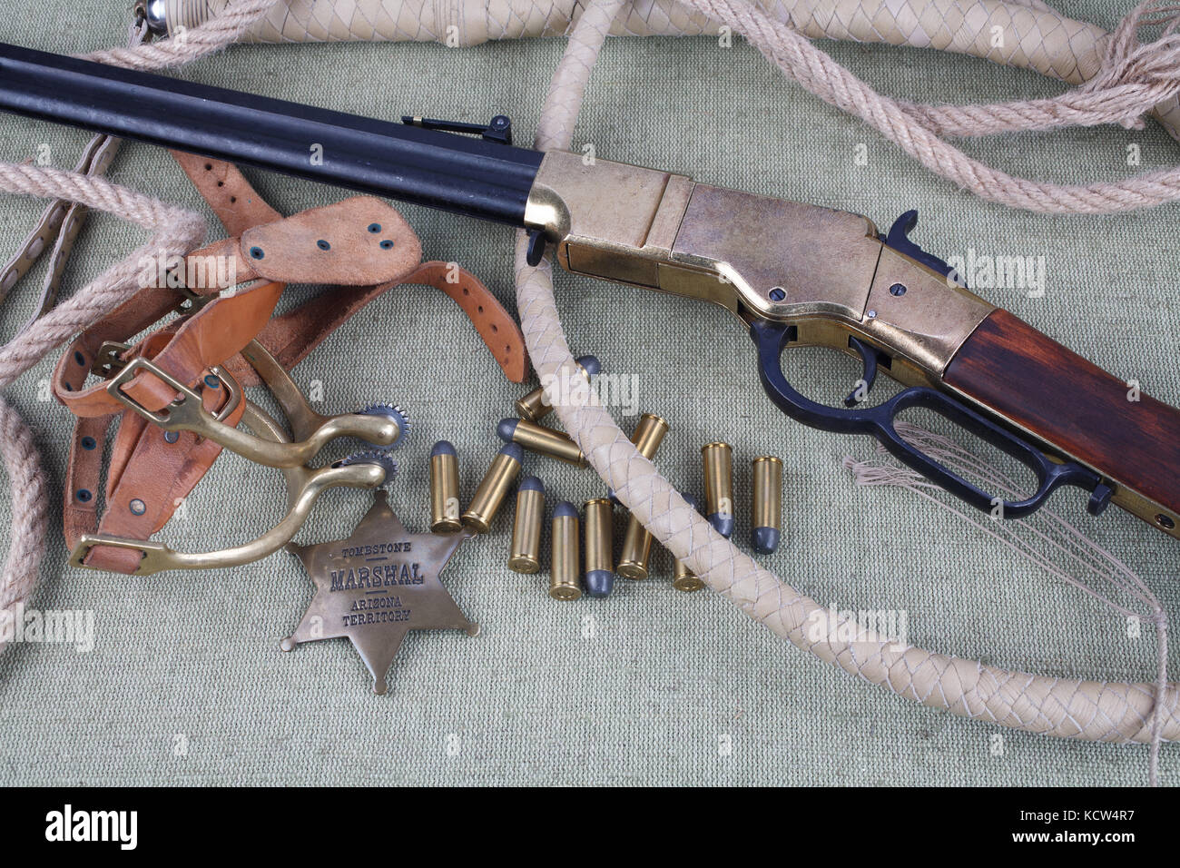 Wild west rifle, ammunition and sheriff badge Stock Photo - Alamy