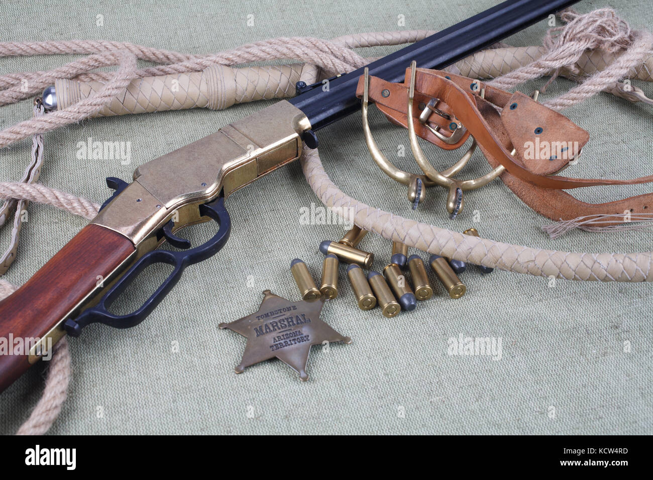Wild west rifle, ammunition and sheriff badge Stock Photo - Alamy
