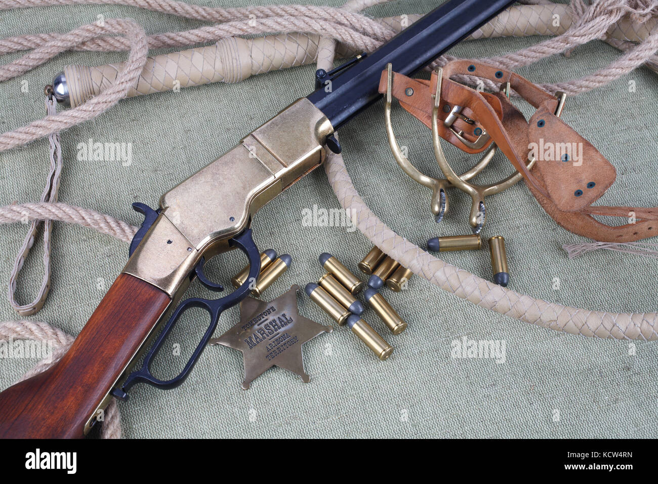 Wild west rifle, ammunition and sheriff badge Stock Photo - Alamy