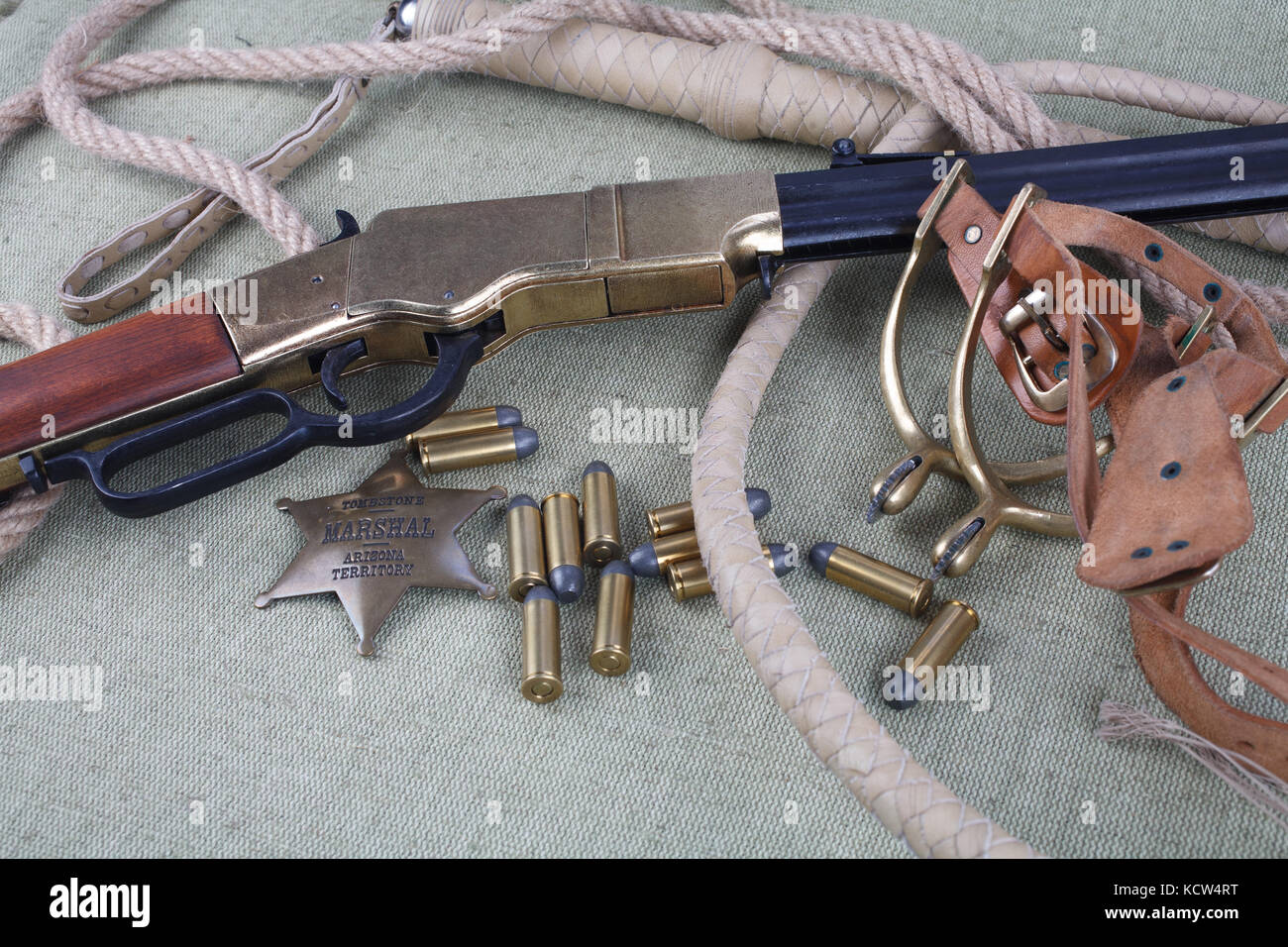 Wild west rifle, ammunition and sheriff badge Stock Photo - Alamy