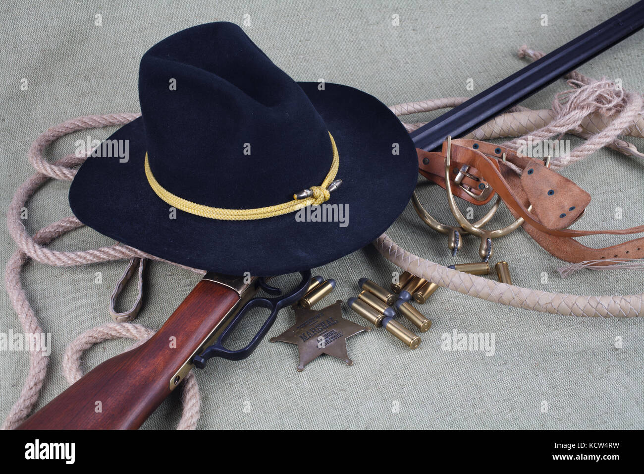 Wild west rifle, ammunition and sheriff badge Stock Photo - Alamy