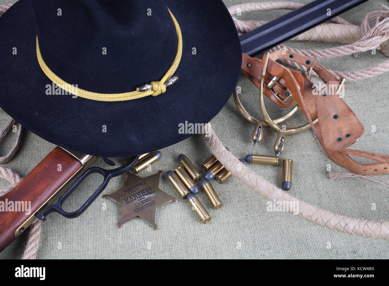 Wild west rifle, ammunition and sheriff badge Stock Photo - Alamy