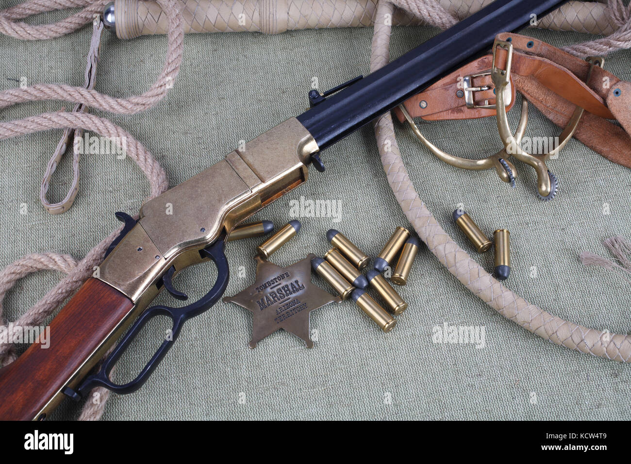 Wild west rifle, ammunition and sheriff badge Stock Photo - Alamy