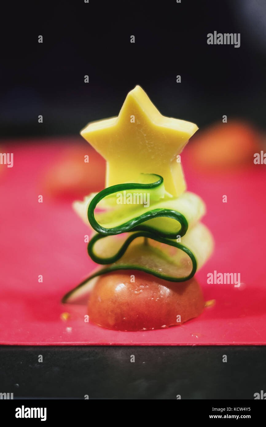 Savory bite of tomato, cucumber and cheese at the food festival in ...