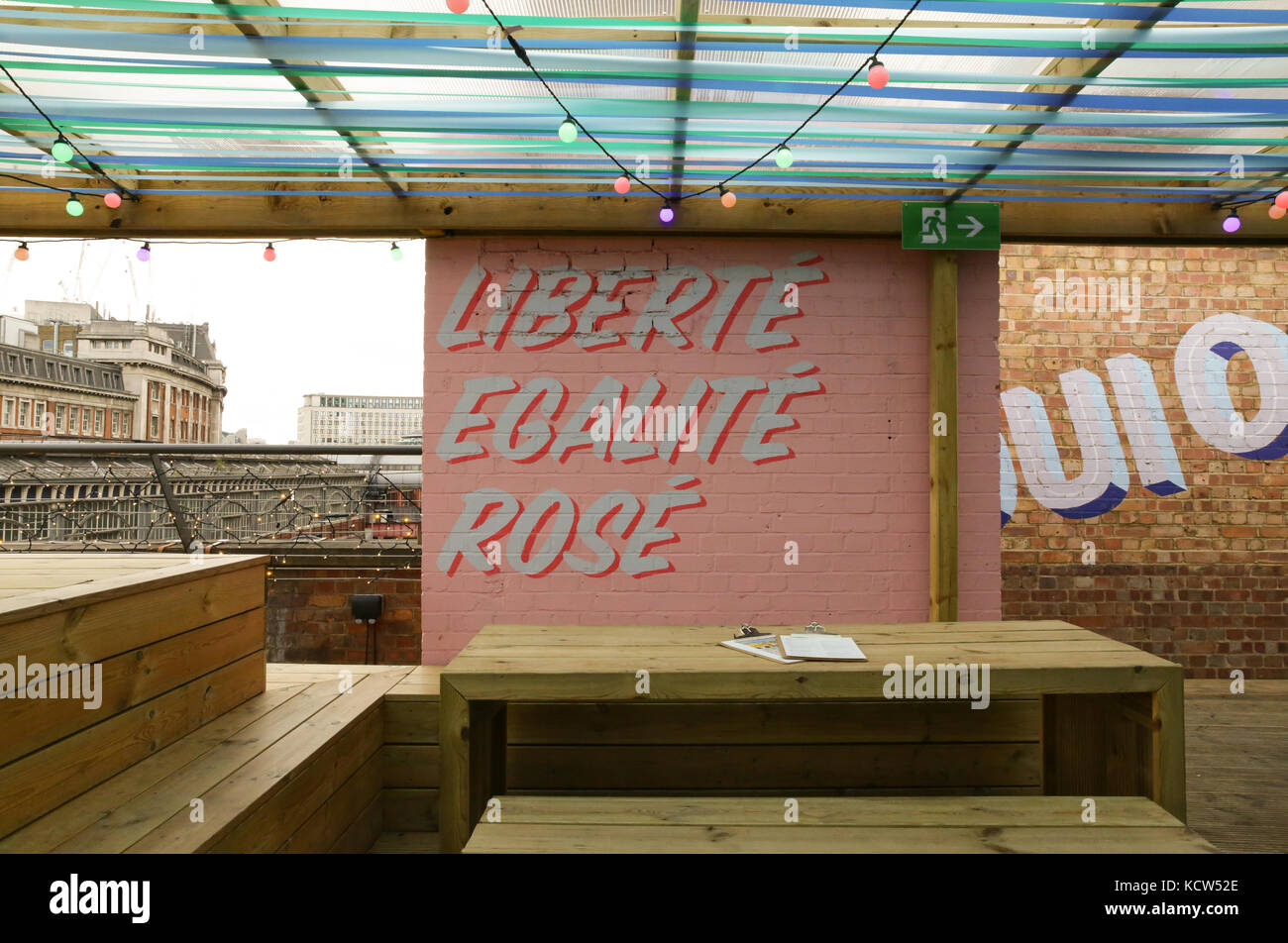 French words painted on a wall at a London rooftop wine bar Stock Photo ...