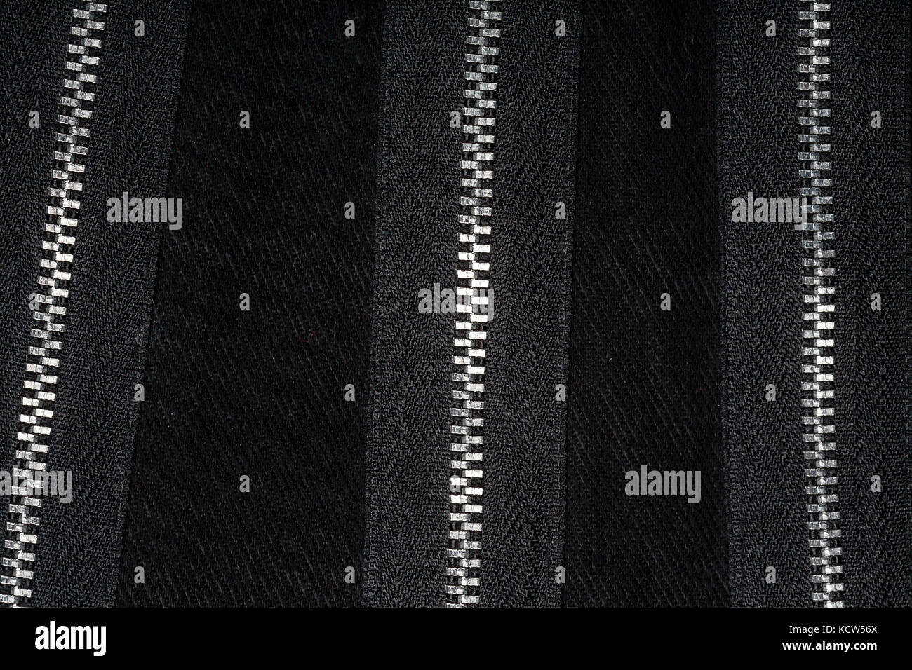 Zippers on black fabric, abstract background Stock Photo - Alamy