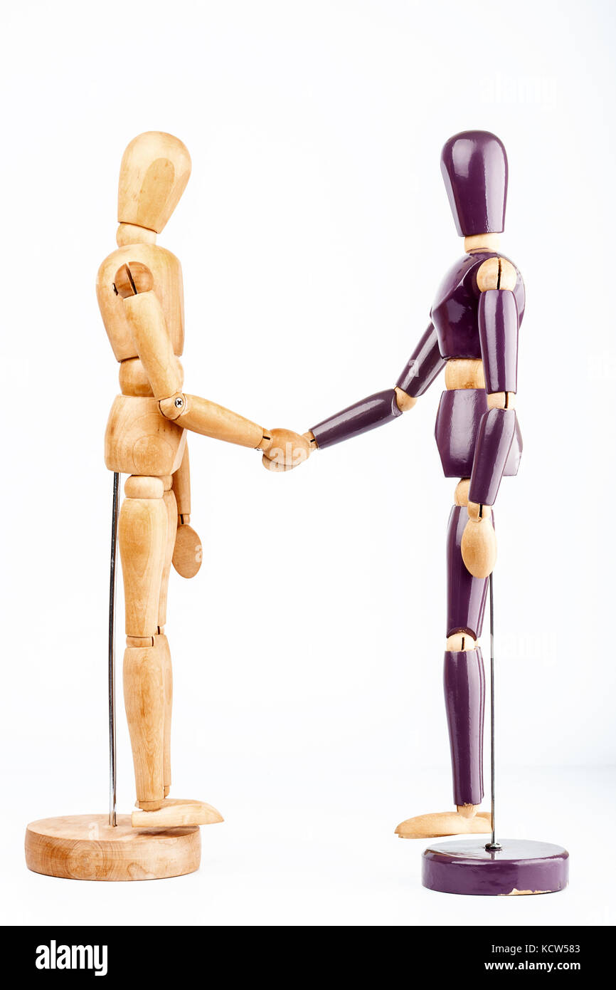 Wooden dummies shaking hands isolated on a white background Stock Photo ...