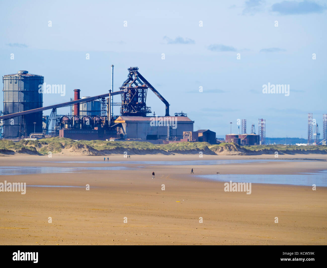 A few people on Coatham beach Redcar on an autumn day, with the now ...