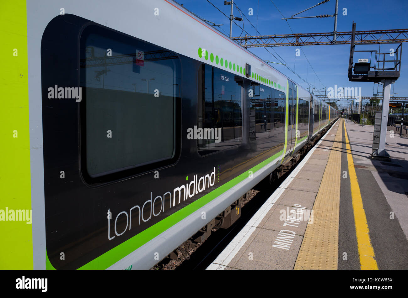 A London Midland train waits at the platform of Northampton Railway ...
