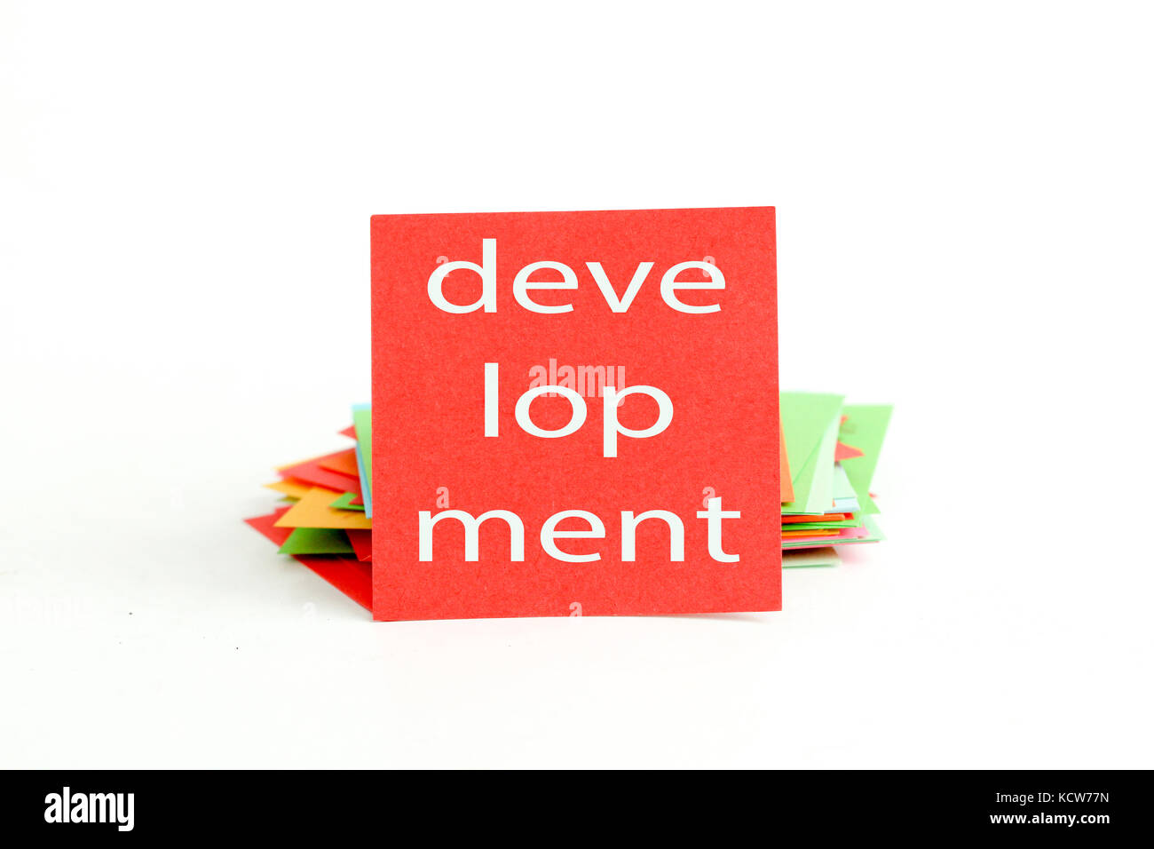 picture of a red note paper with text development Stock Photo - Alamy