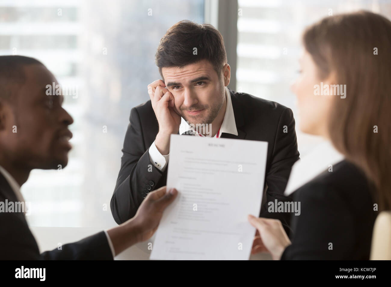 Worried male job candidate interested in company vacancy anxiously ...