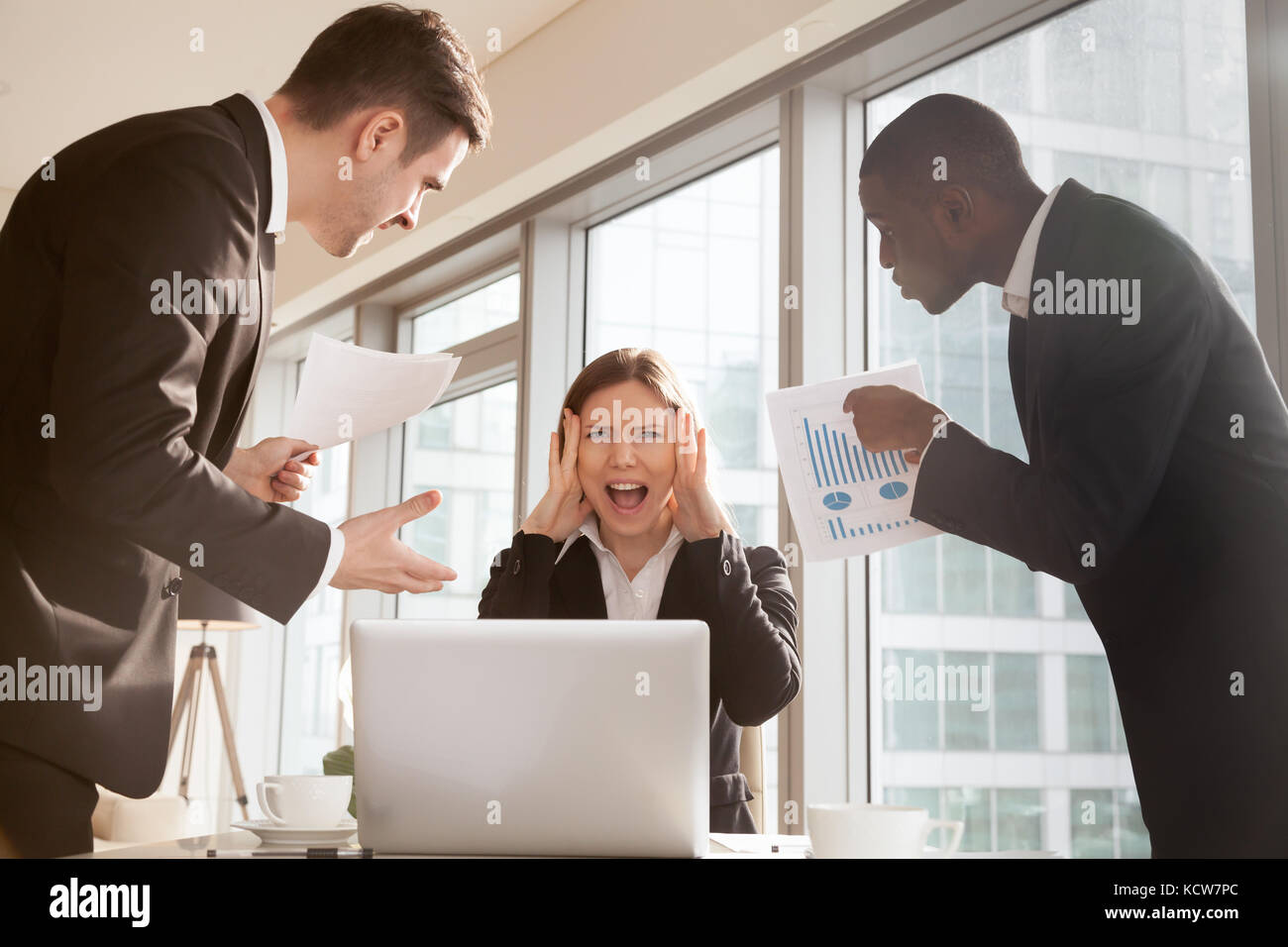 Businesswoman holding head with hands and screaming surrounded by ...