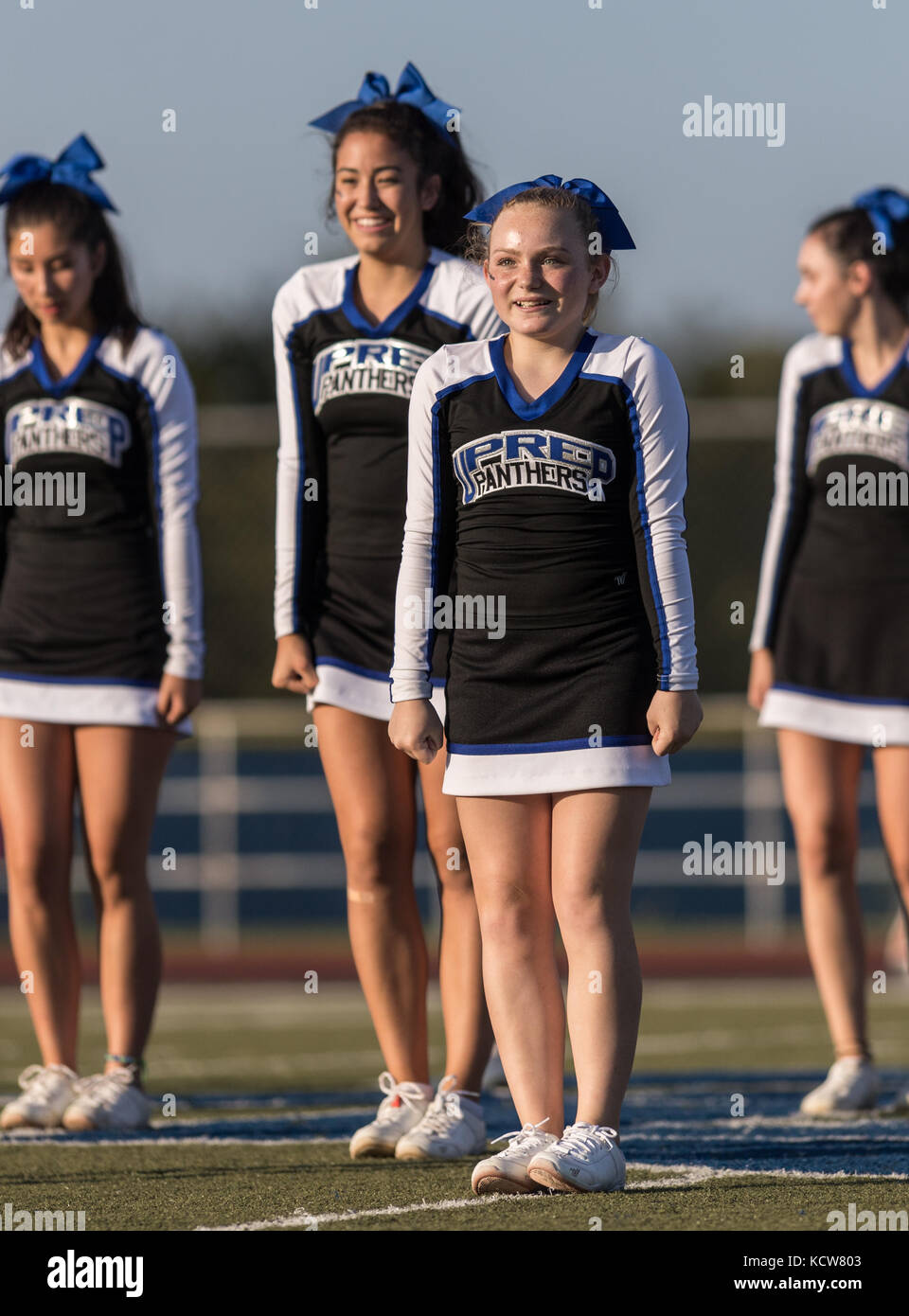 Cheerleaders in action at a football game half time show in Redding ...