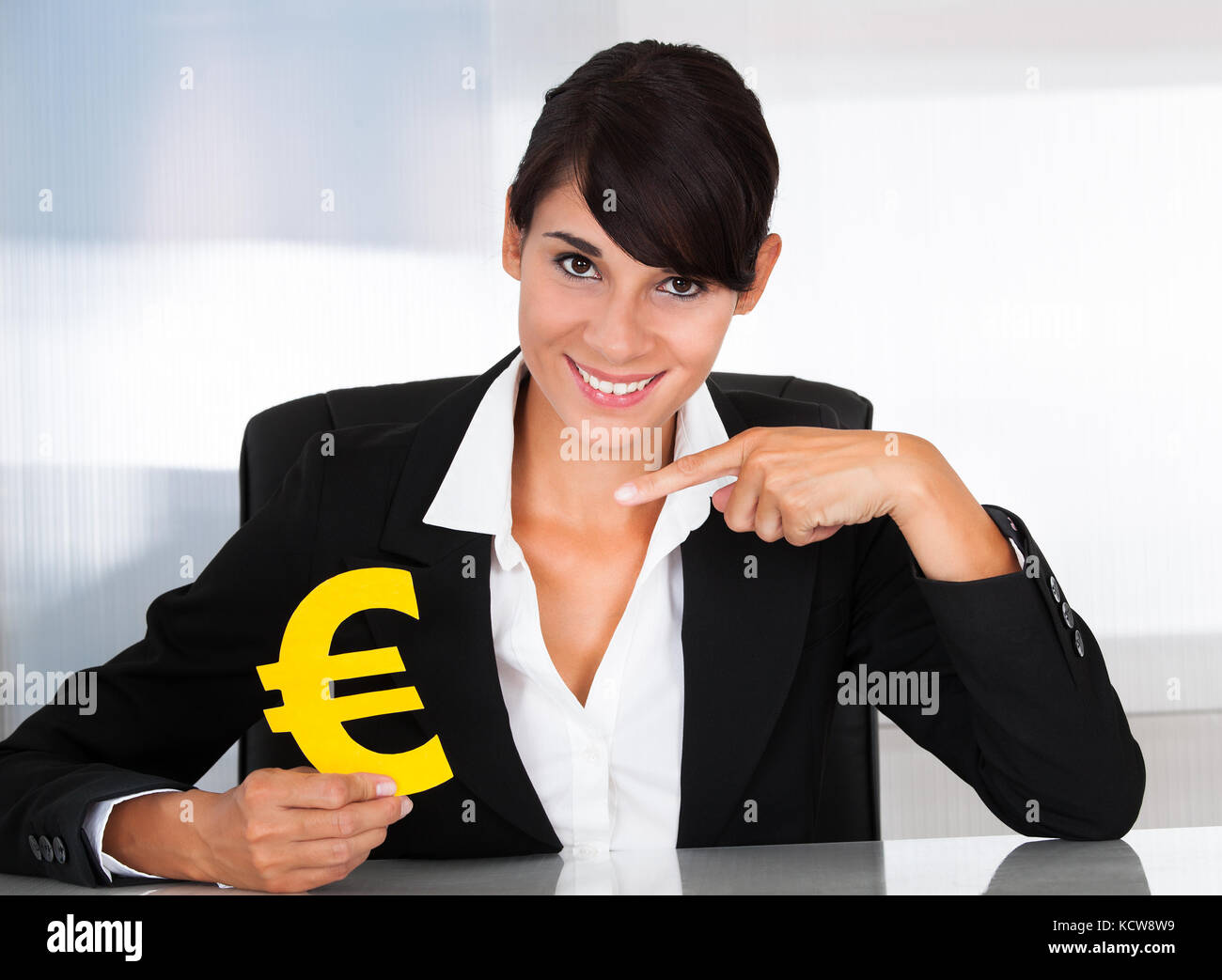 Close-up Of Hand Holding Yellow Euro Sign In Hand Stock Photo - Alamy