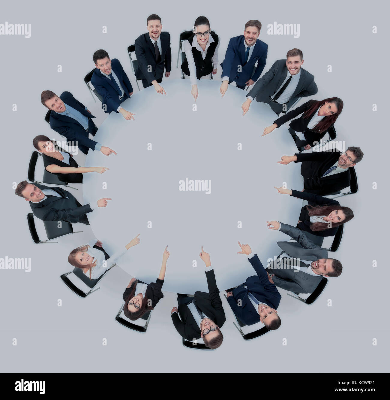 Happy business team pointing at something Stock Photo - Alamy