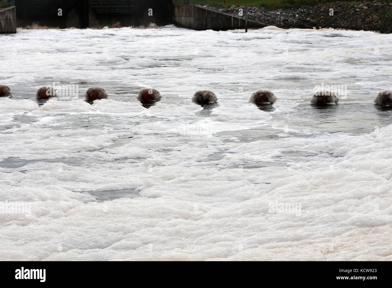 Foam on the surface of a river Stock Photo - Alamy