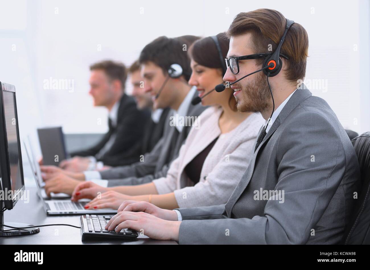 colleagues call centre workplace in the office Stock Photo - Alamy