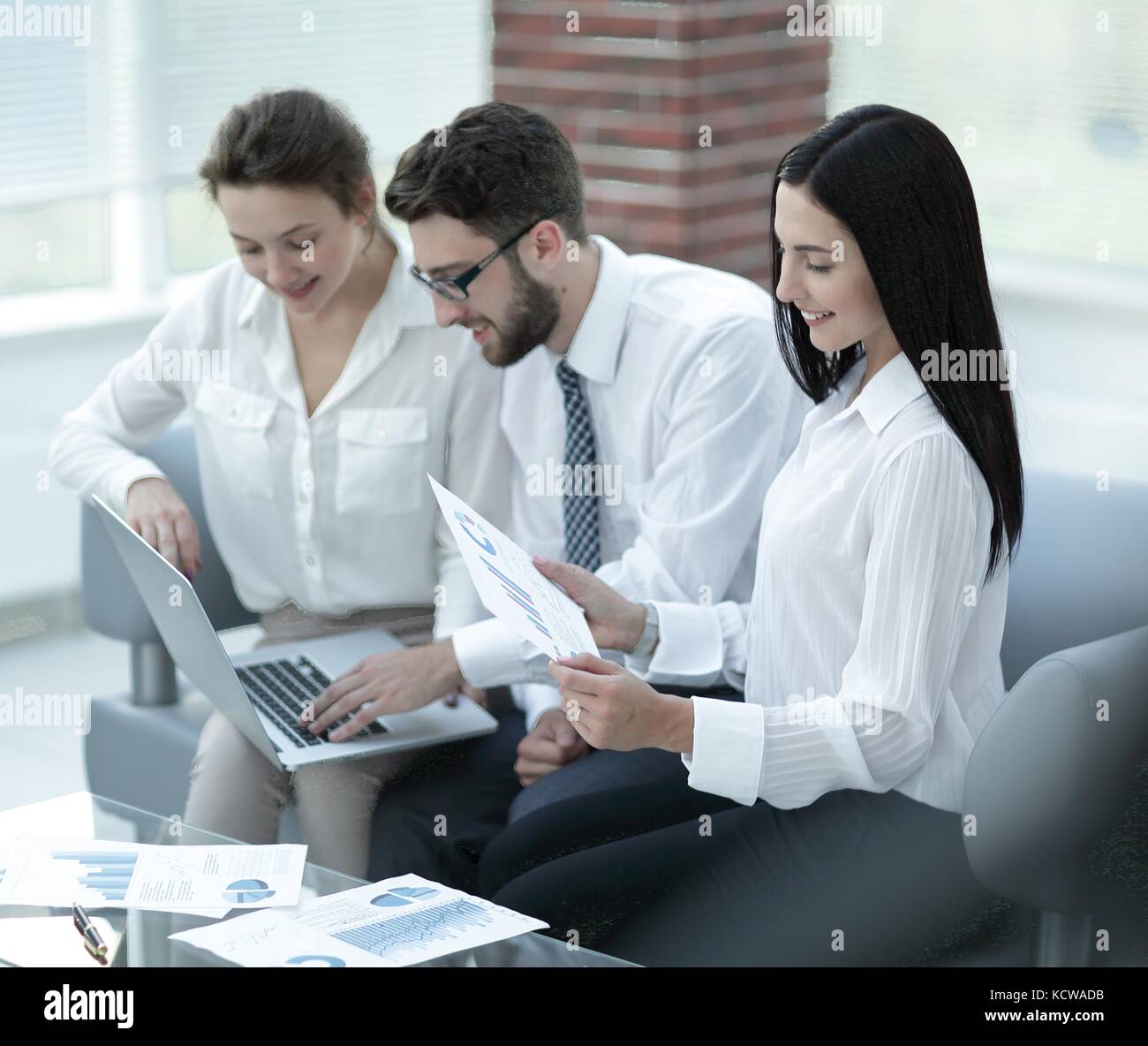 business team working with financial charts in the office Stock Photo ...
