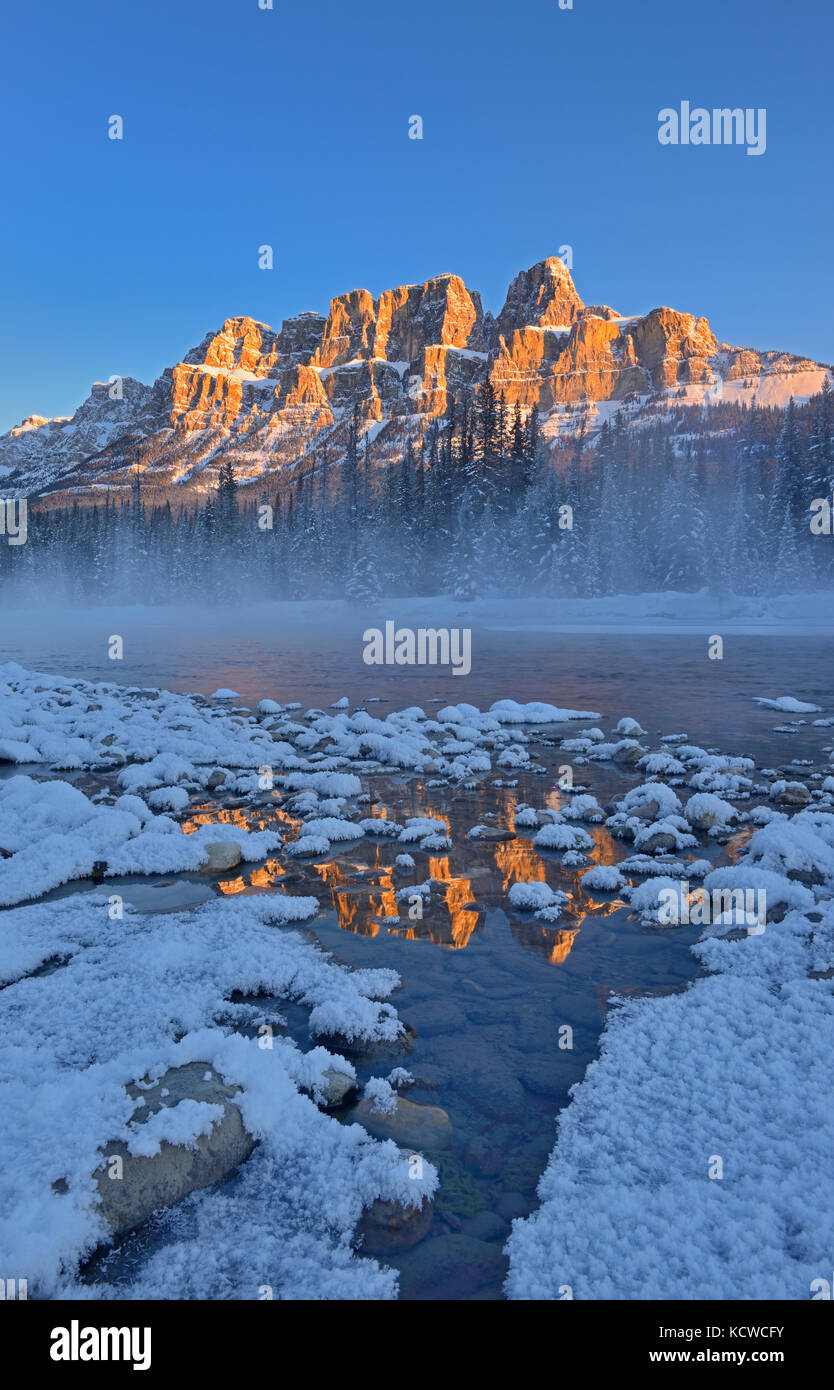 Castle Mountain reflected in the Bow River. at sunrise. Castle Junction ...
