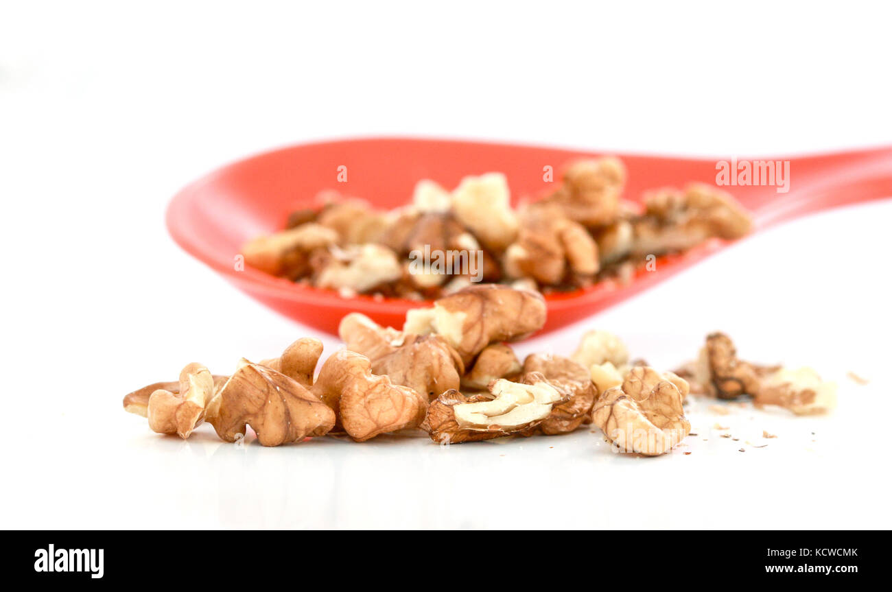 crushed walnuts on white background,image of a Stock Photo - Alamy