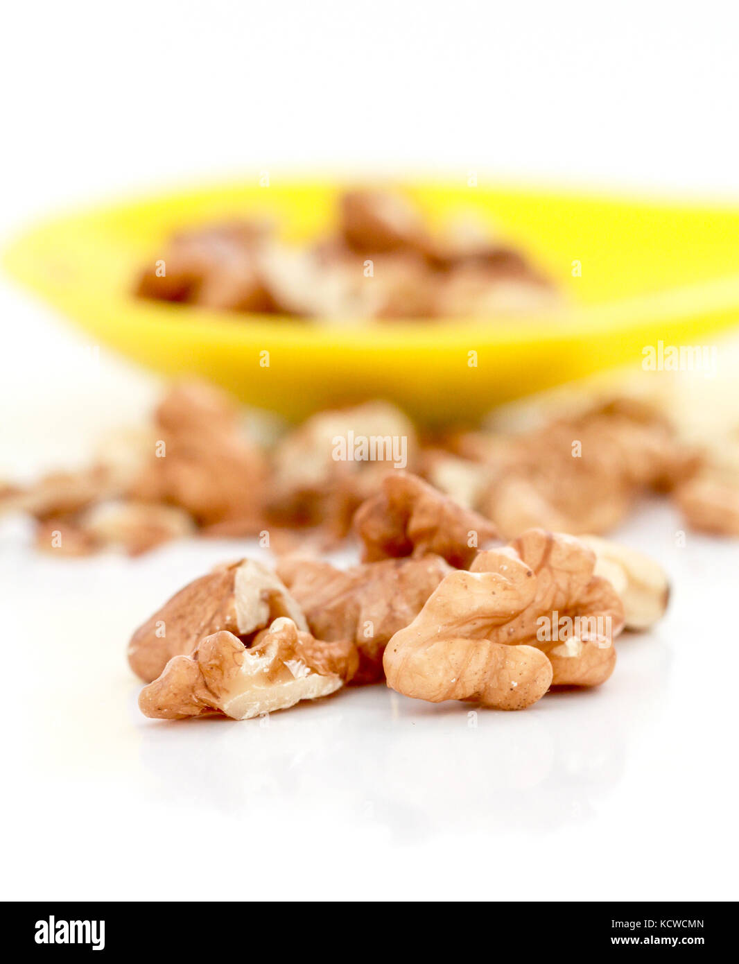 crushed walnuts on white background,image of a Stock Photo - Alamy