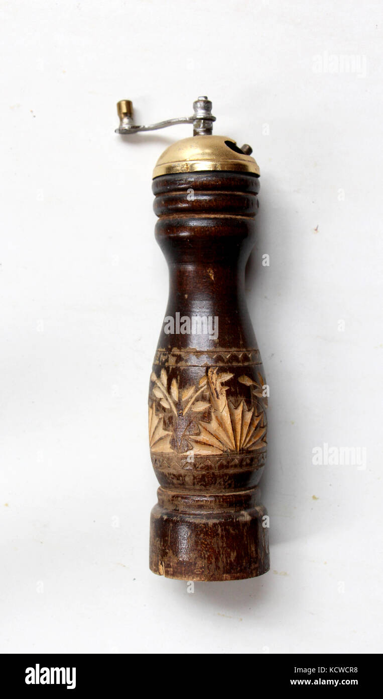 old pepper mill on white Stock Photo - Alamy