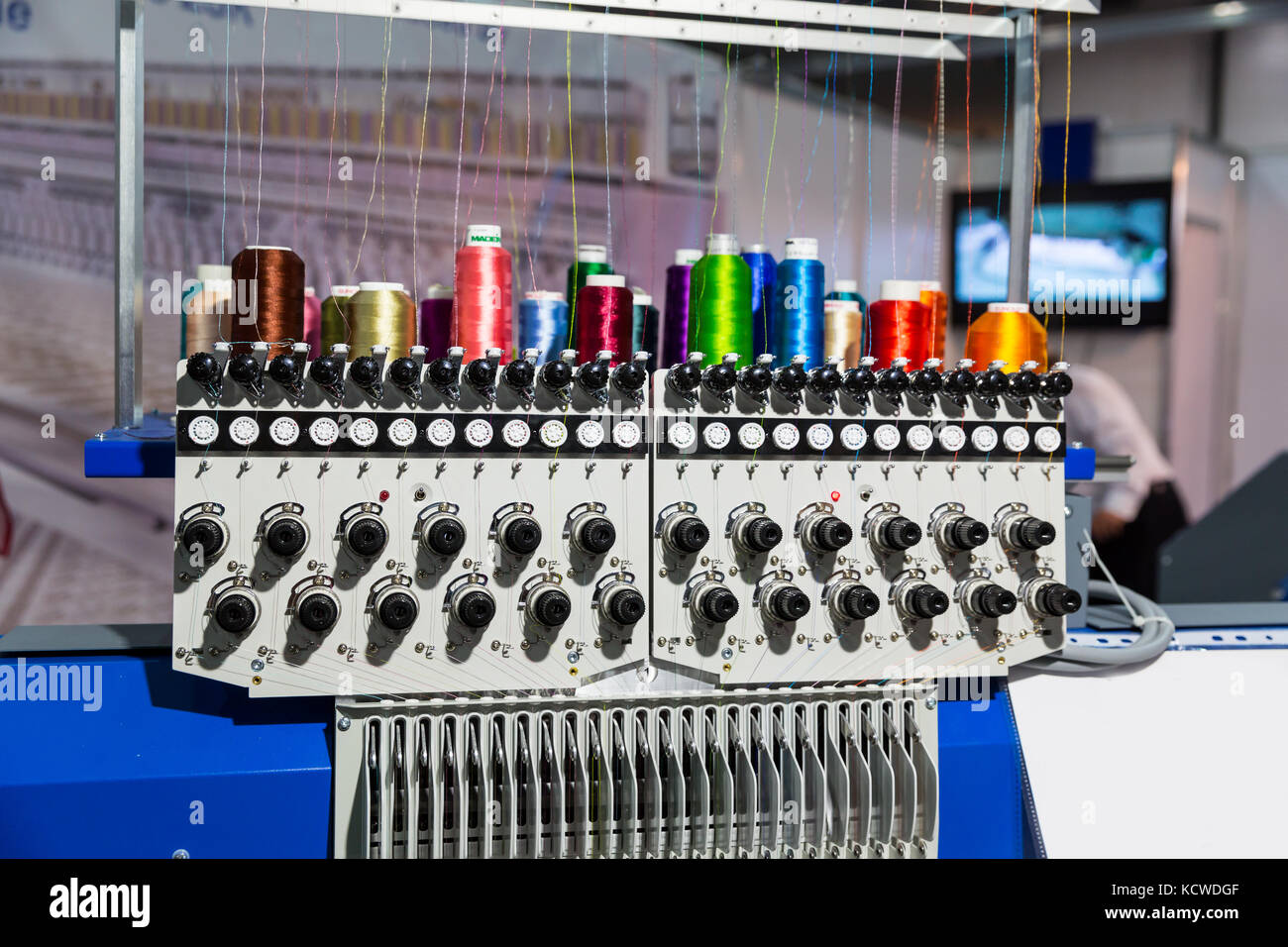 Professional sewing machine with spools of thread closeup. Textile ...