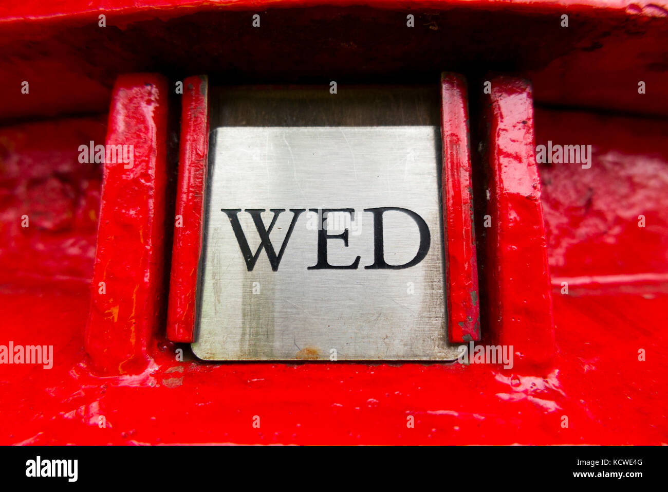 Day of the week letter collection plate / next collection sign on a red ...