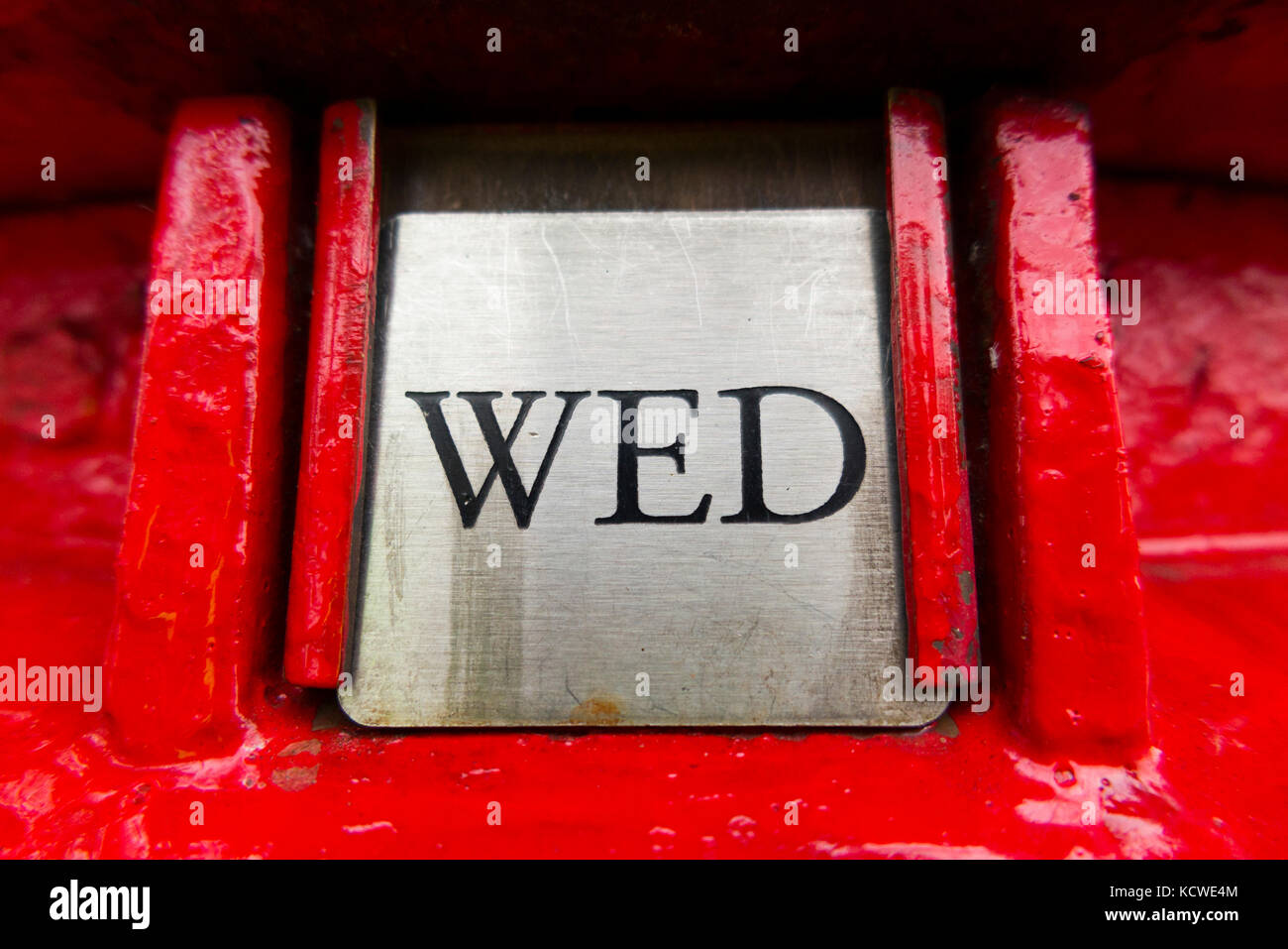 Day of the week letter collection plate / next collection sign on a red ...