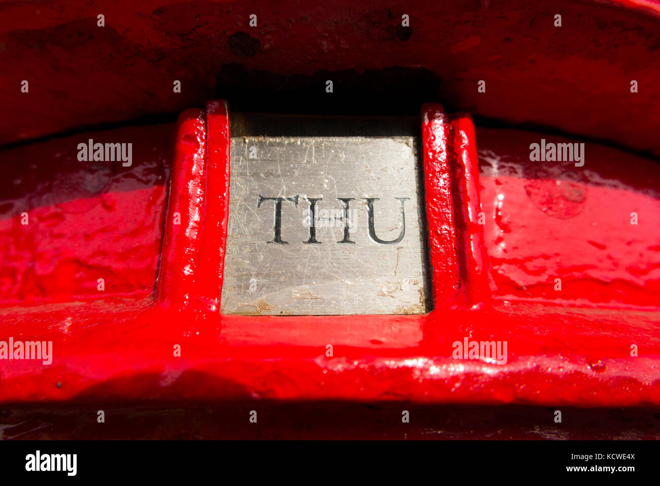 Day of the week letter collection plate / next collection sign on a red ...