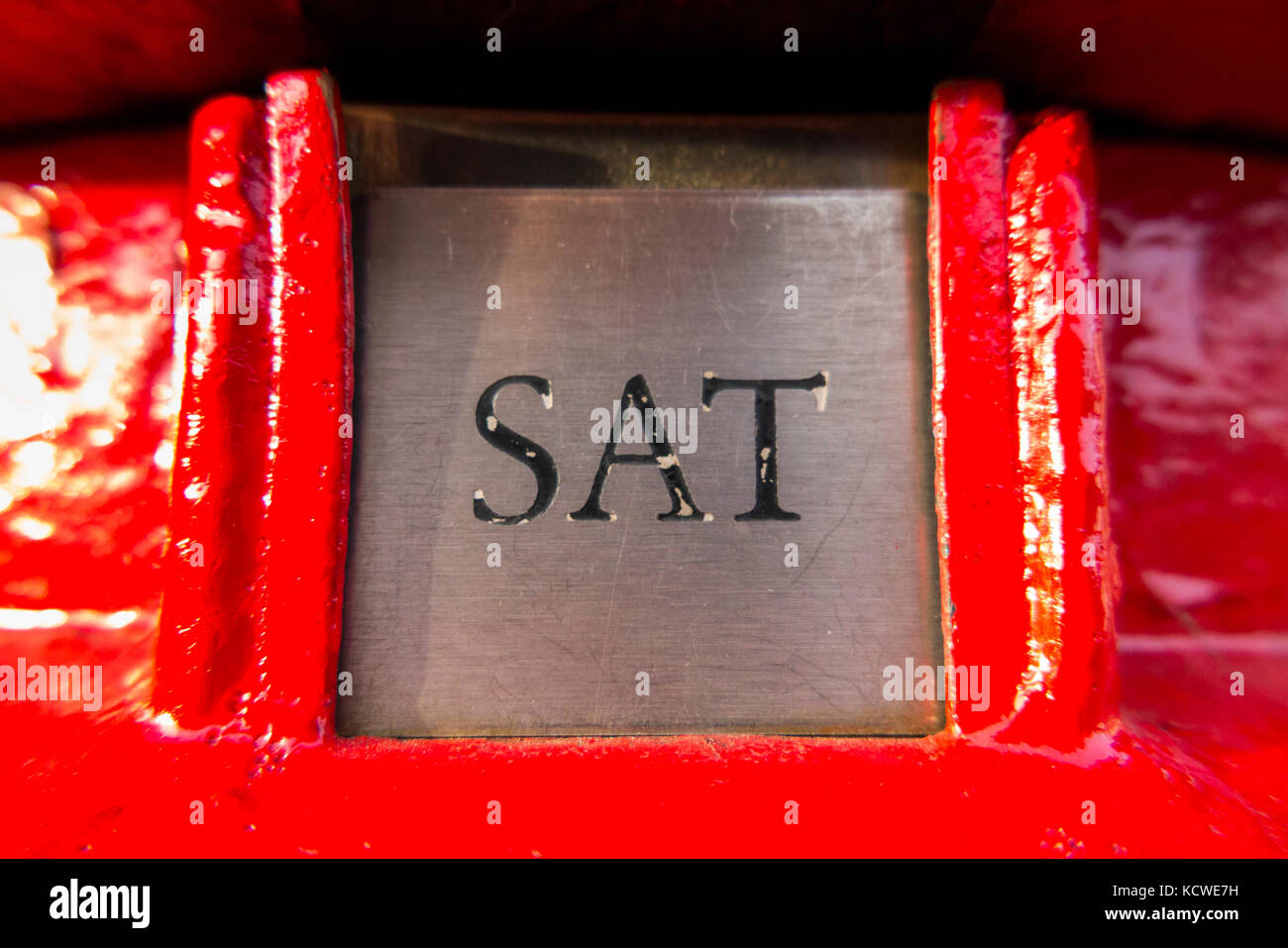 Day of the week letter collection plate / next collection sign on a red ...