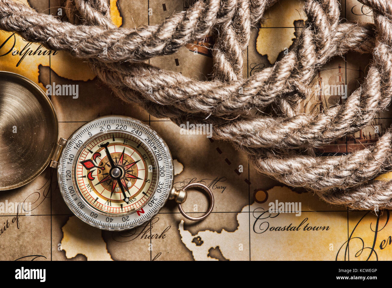 compass and rope on a map Stock Photo - Alamy
