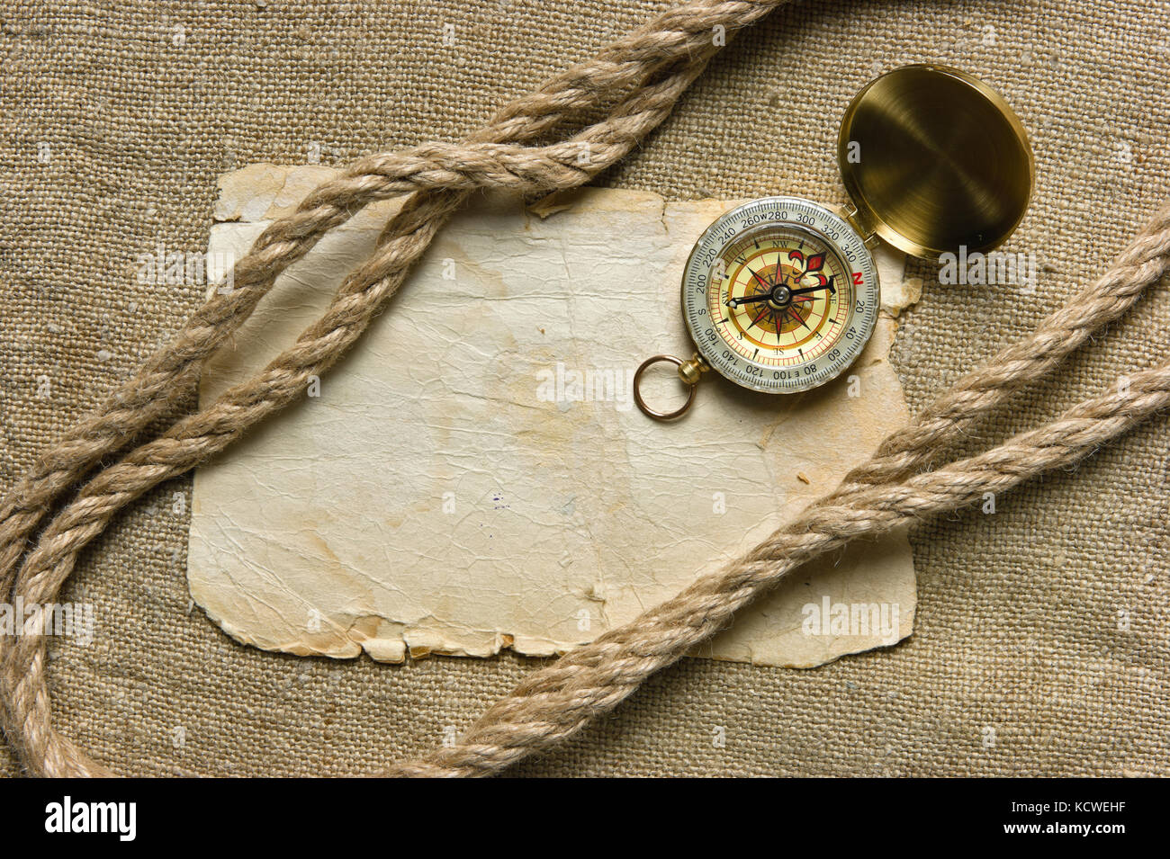 Vintage background with old paper and compass Stock Photo - Alamy