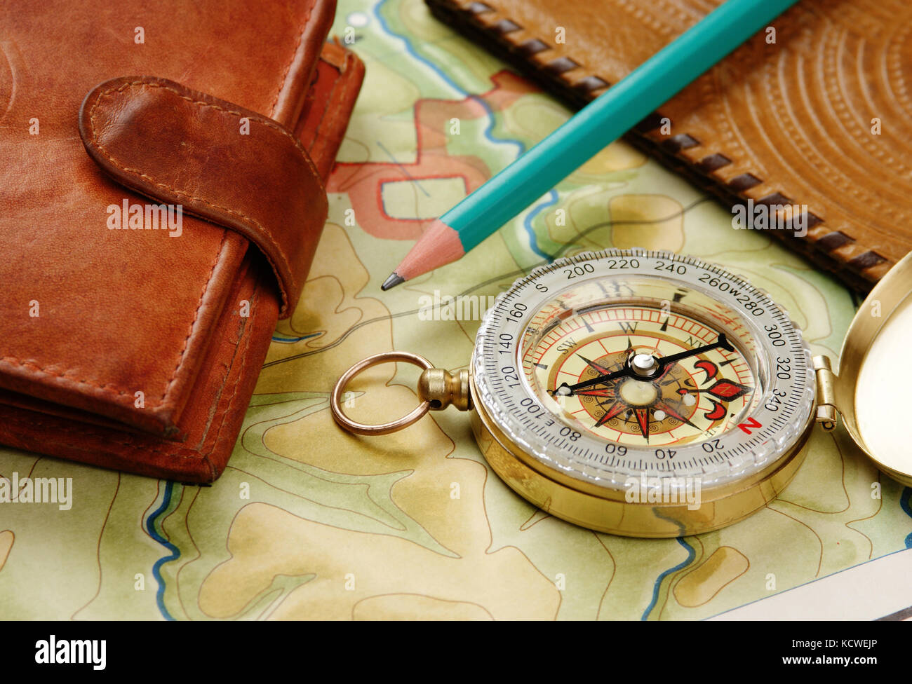 compass wallet and passport on the old map Stock Photo - Alamy