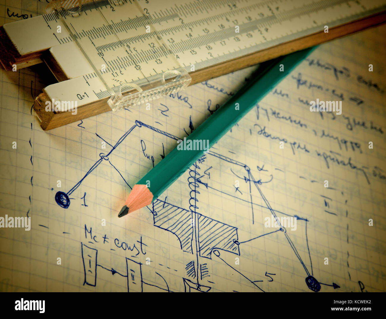 pencil and a slide rule on the old page with the calculations in ...