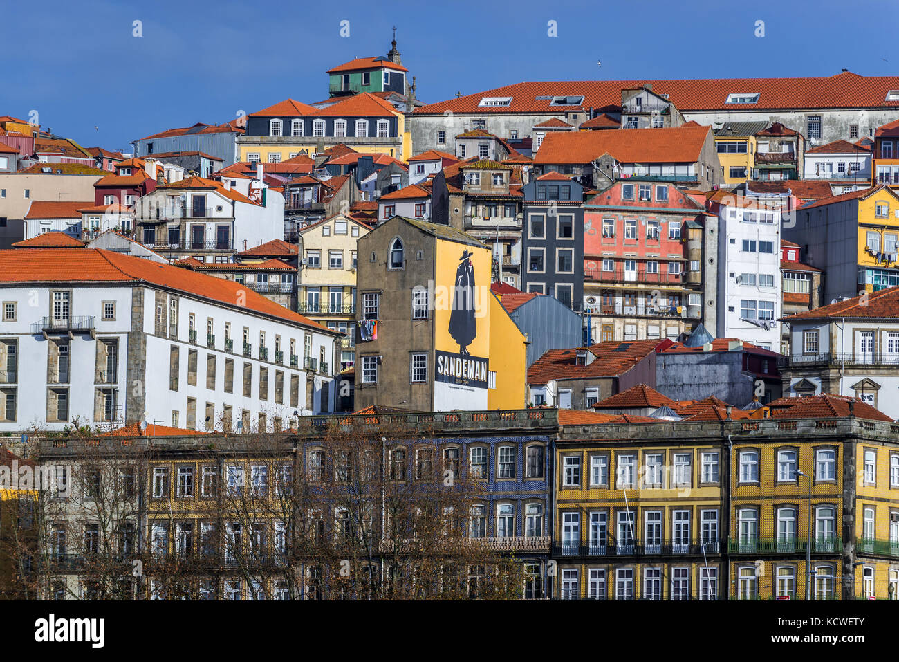Porto city buildings in Ribeira District with Sandeman sign seen from ...