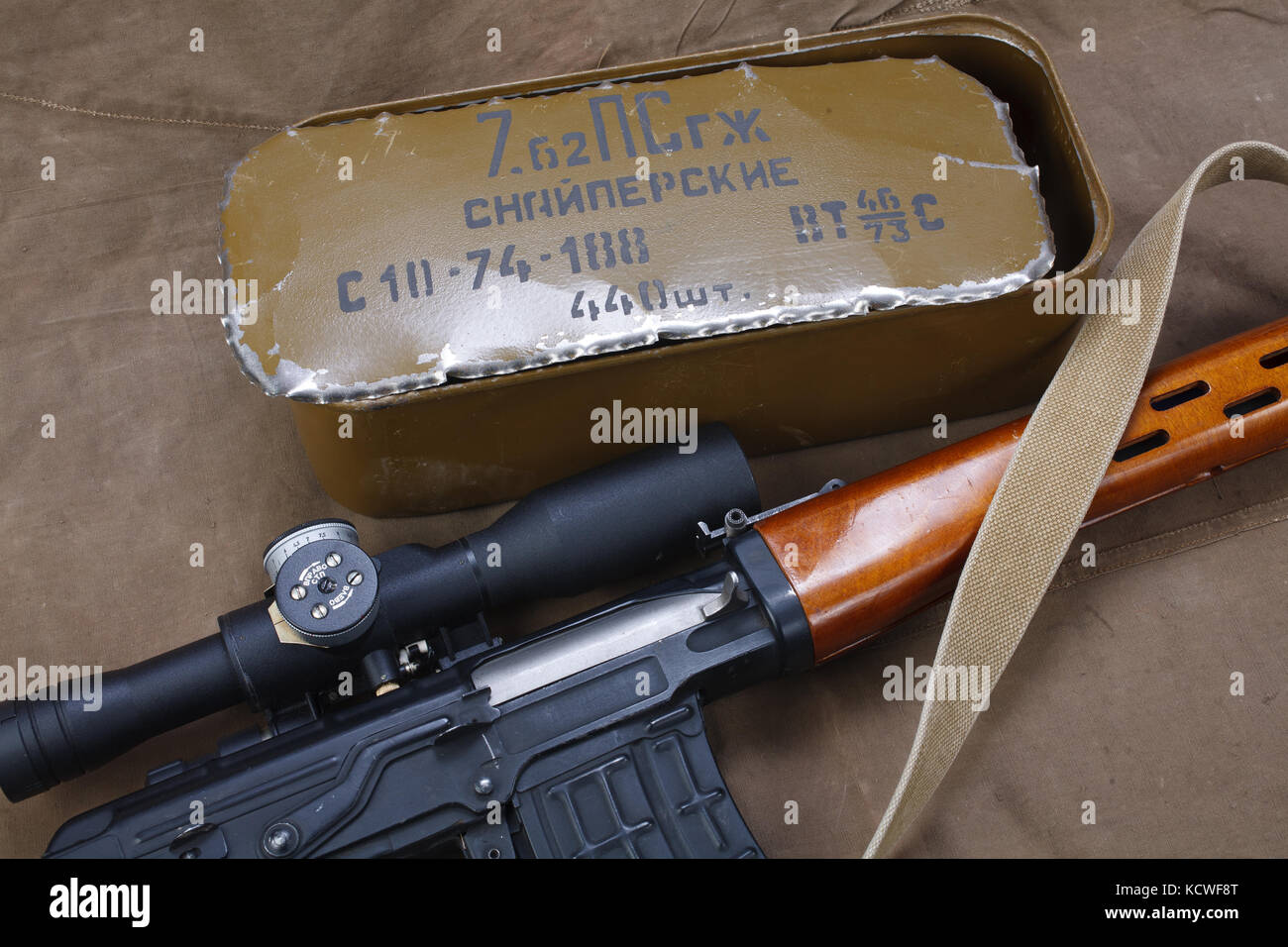 SVD sniper rifle with box of ammunition on canvas background. The ...