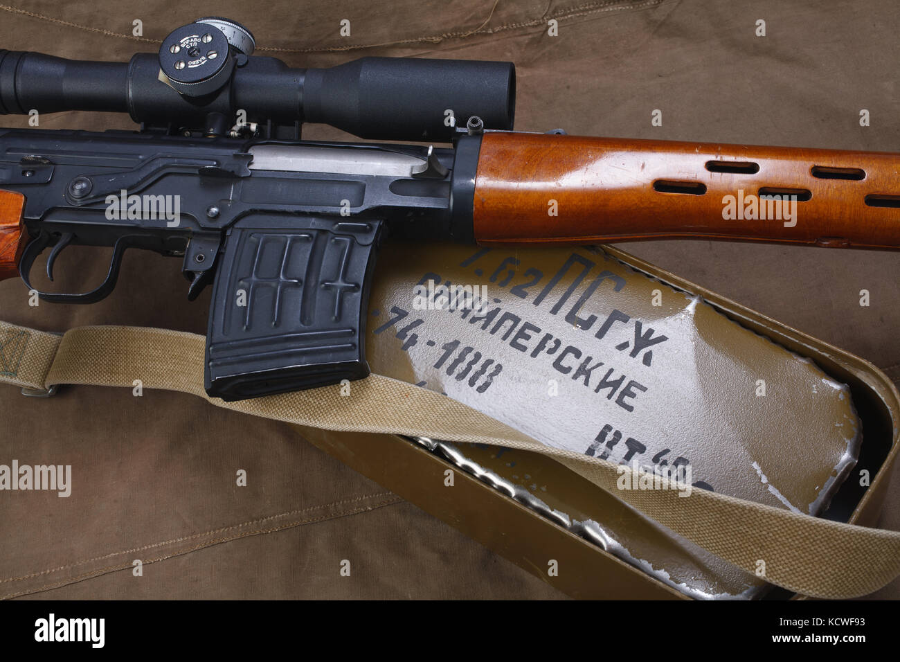 SVD sniper rifle with box of ammunition on canvas background. The ...