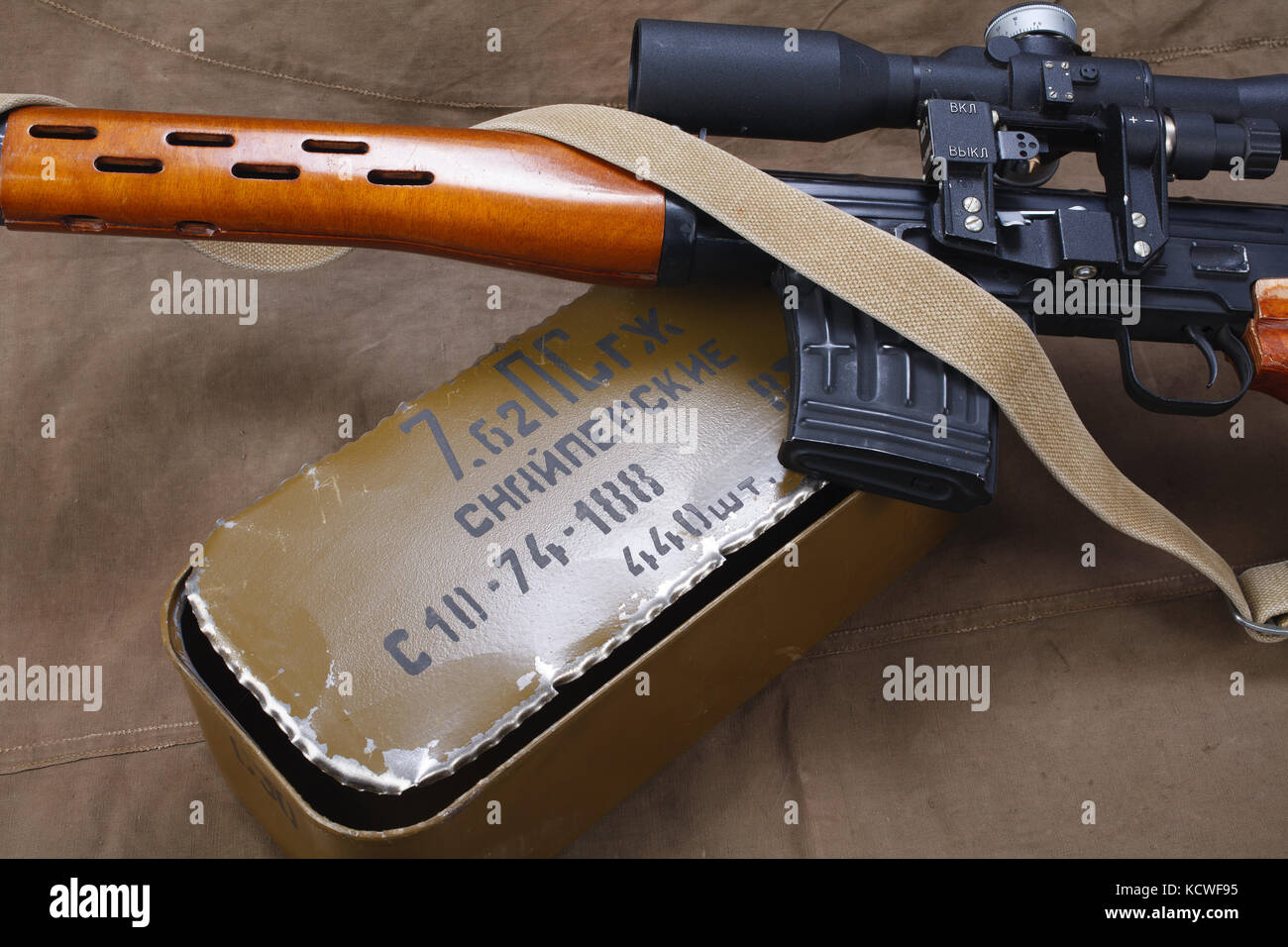SVD sniper rifle with box of ammunition on canvas background. The ...