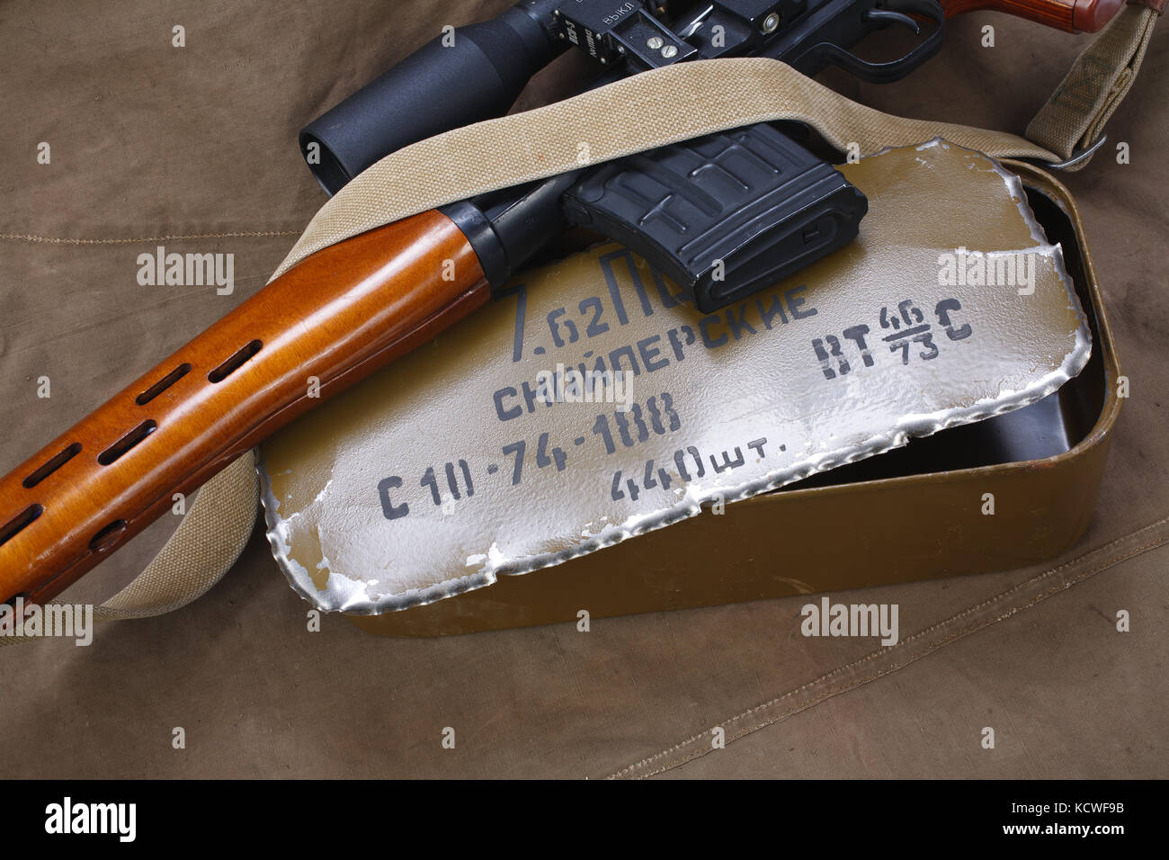 SVD sniper rifle with box of ammunition on canvas background. The ...