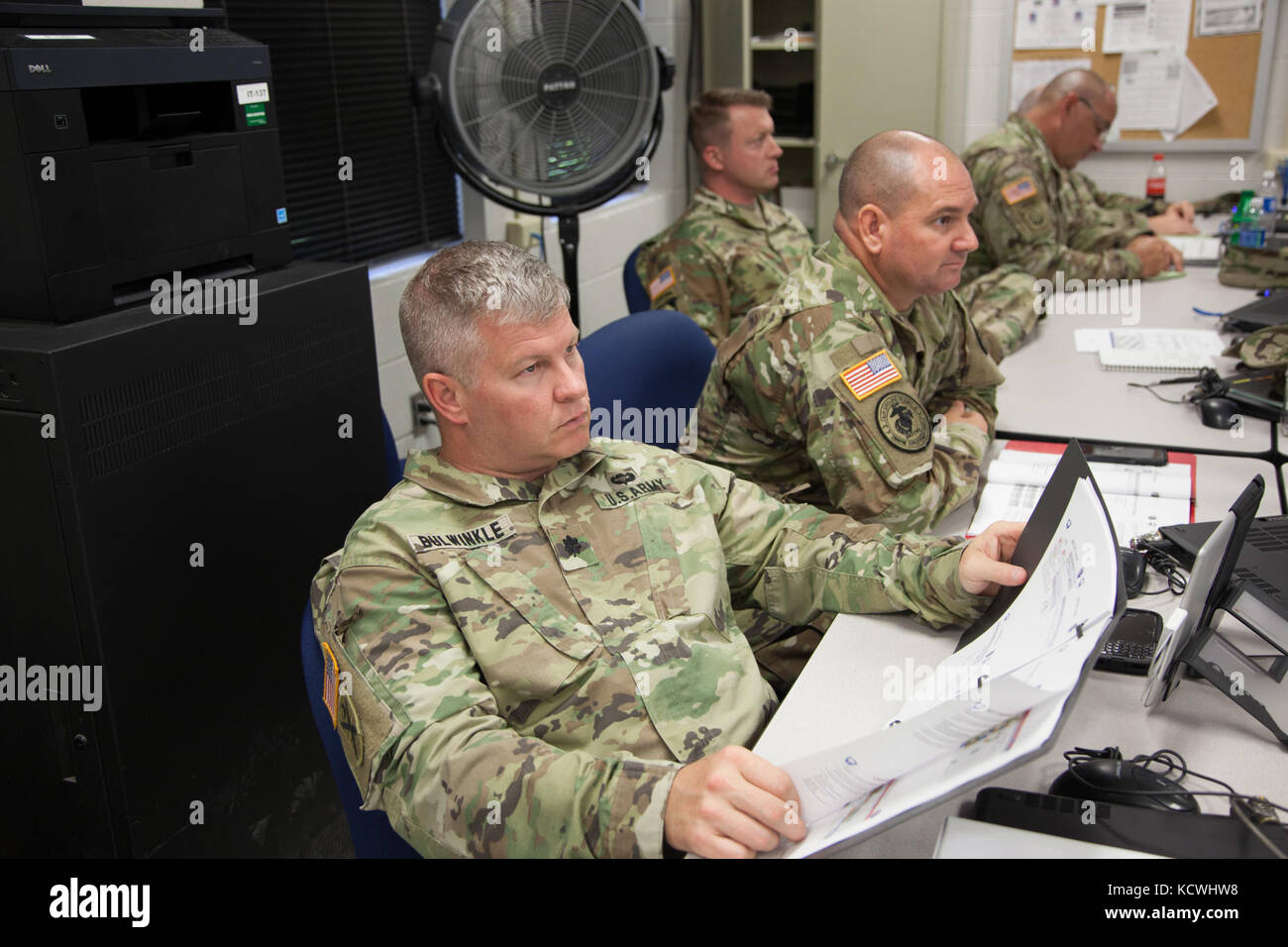 Attendees participate in briefings and work groups during the TAG ...