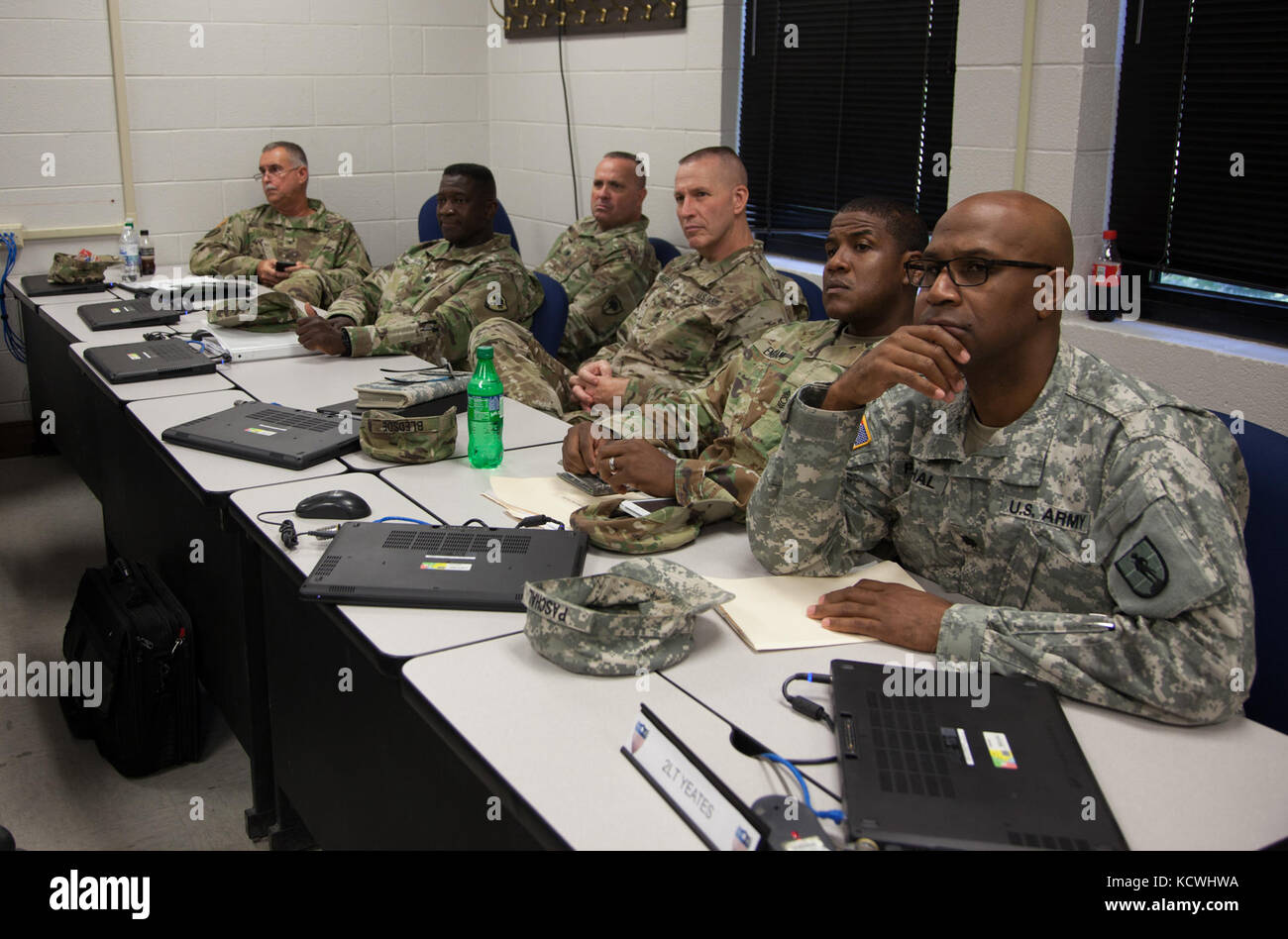 Attendees participate in briefings and work groups during the TAG ...