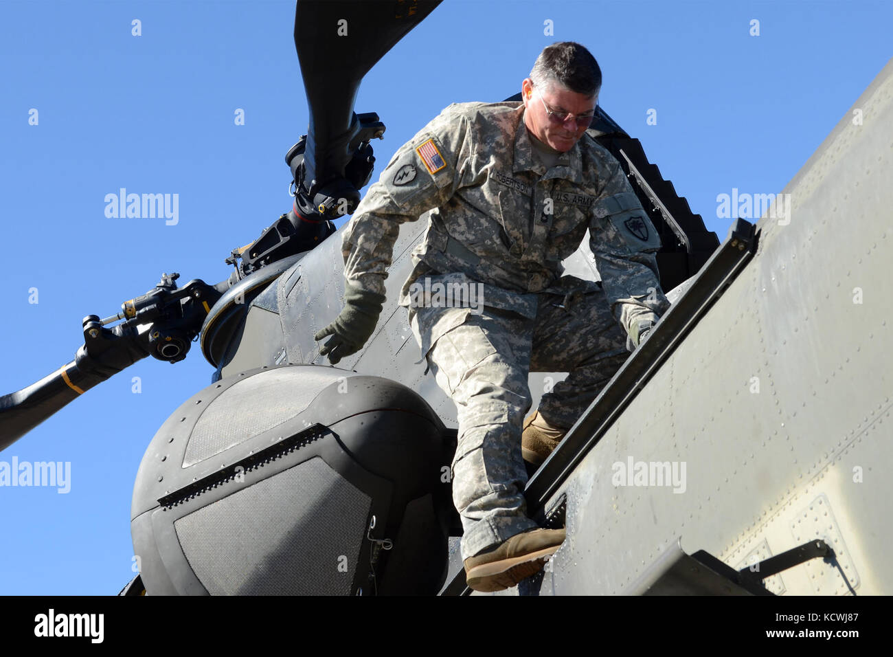 U.S. Army Sgt. 1st Class Randy Robertson, troubleshoots an oil pressure ...