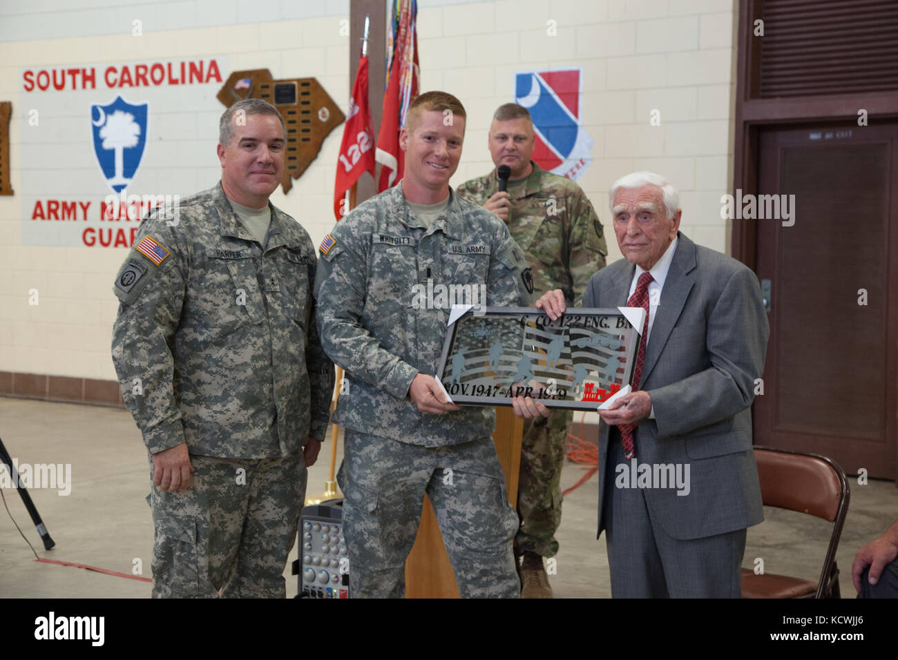 Mr. William Zimmerman receives a gift from the Soldiers of the 122nd ...