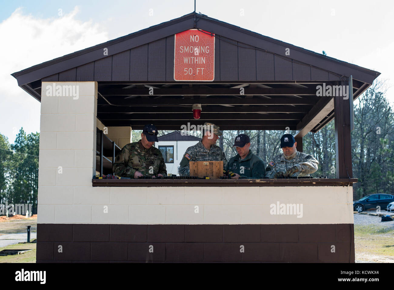 U.S. Soldiers assigned to the South Carolina Army National Guard load ...
