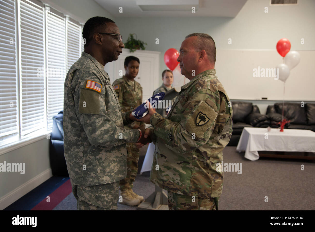 U.S. Army Lt. Col. Robert Downs presents Master Sgt. Theodore Wilder ...