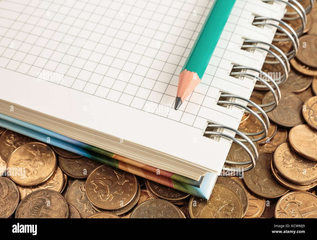 Notepad coins hi-res stock photography and images - Alamy