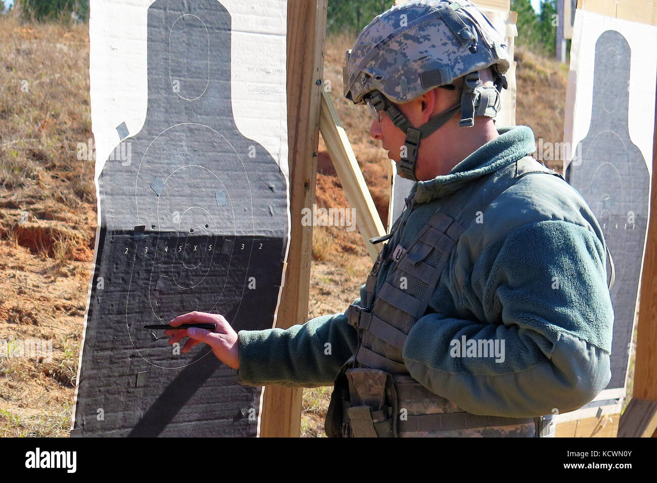 A South Carolina Army National Guard Soldier checks his target at an M9 ...