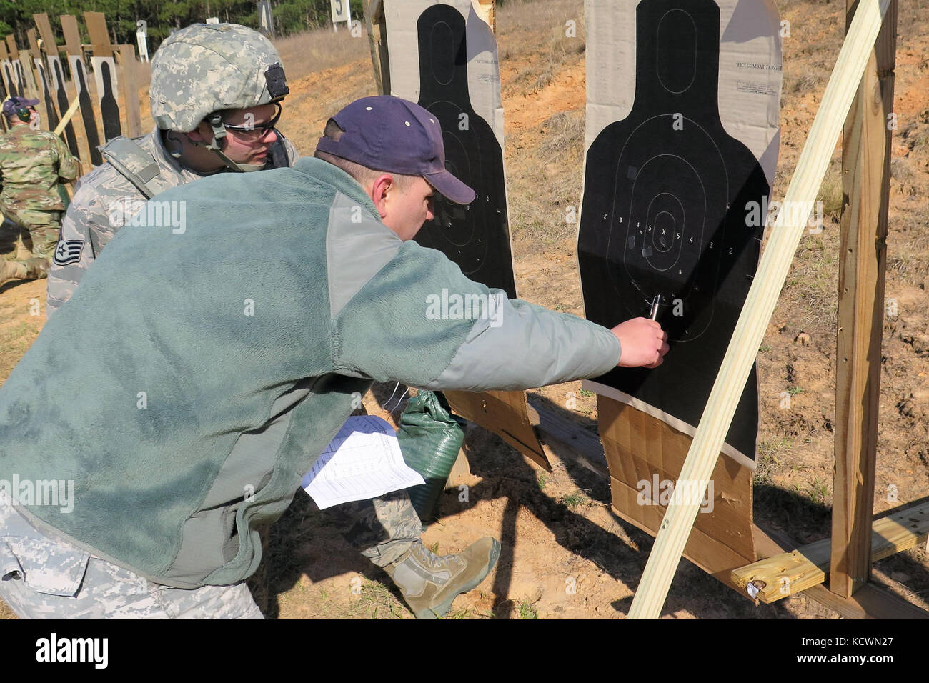A South Carolina Army National Guard Soldier checks his target at an M9 ...